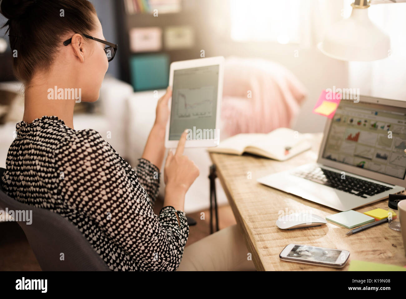 Woman analysing some very important data Stock Photo - Alamy