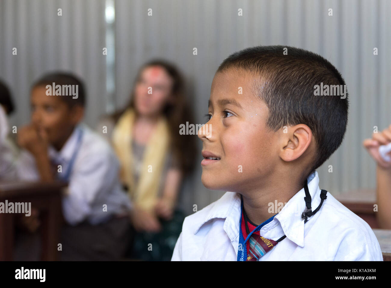 School children in the rural town of Dhulikhel enjoying a lesson from ...