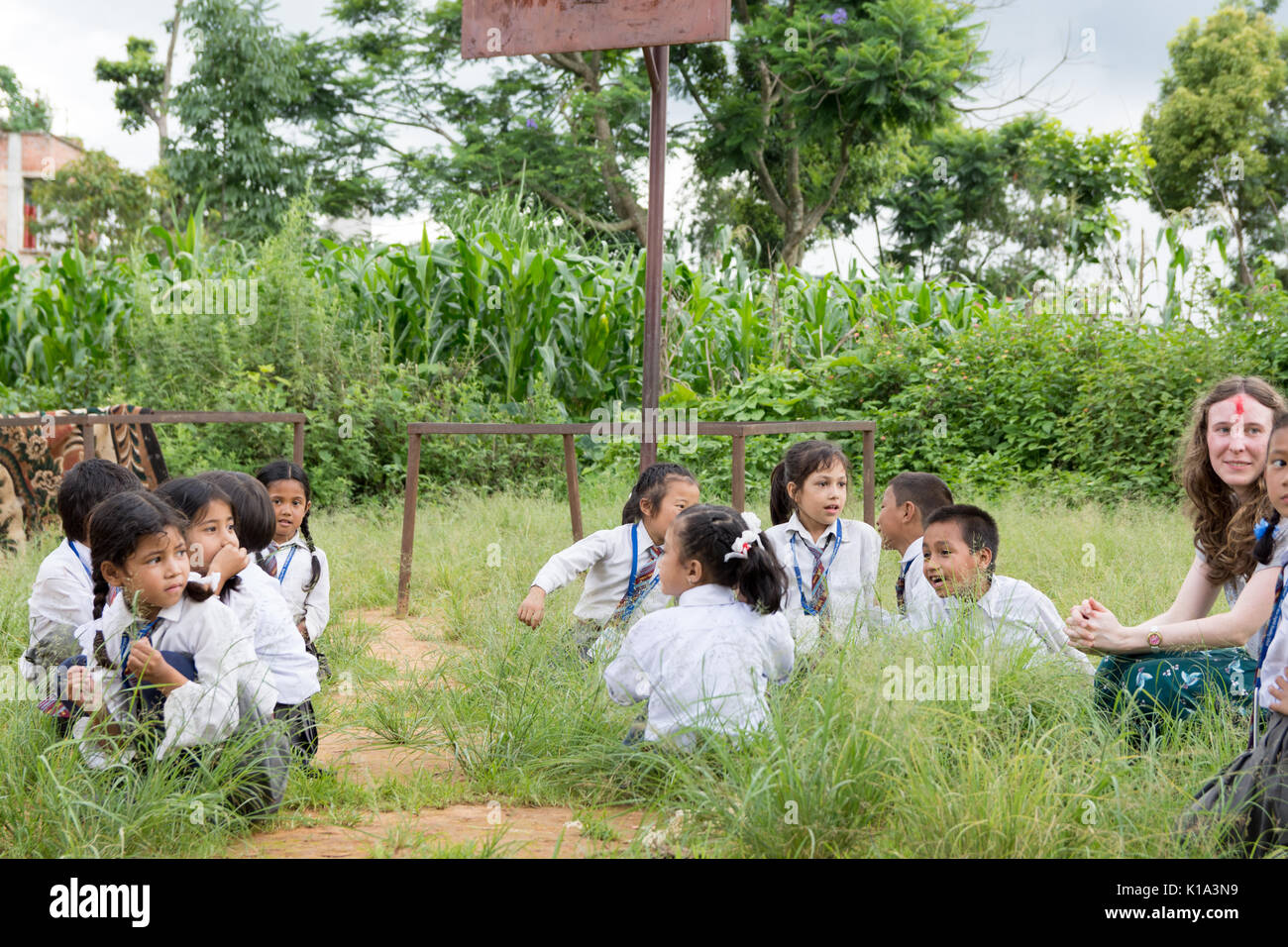 School children in the rural town of Dhulikhel enjoying a lesson from ...