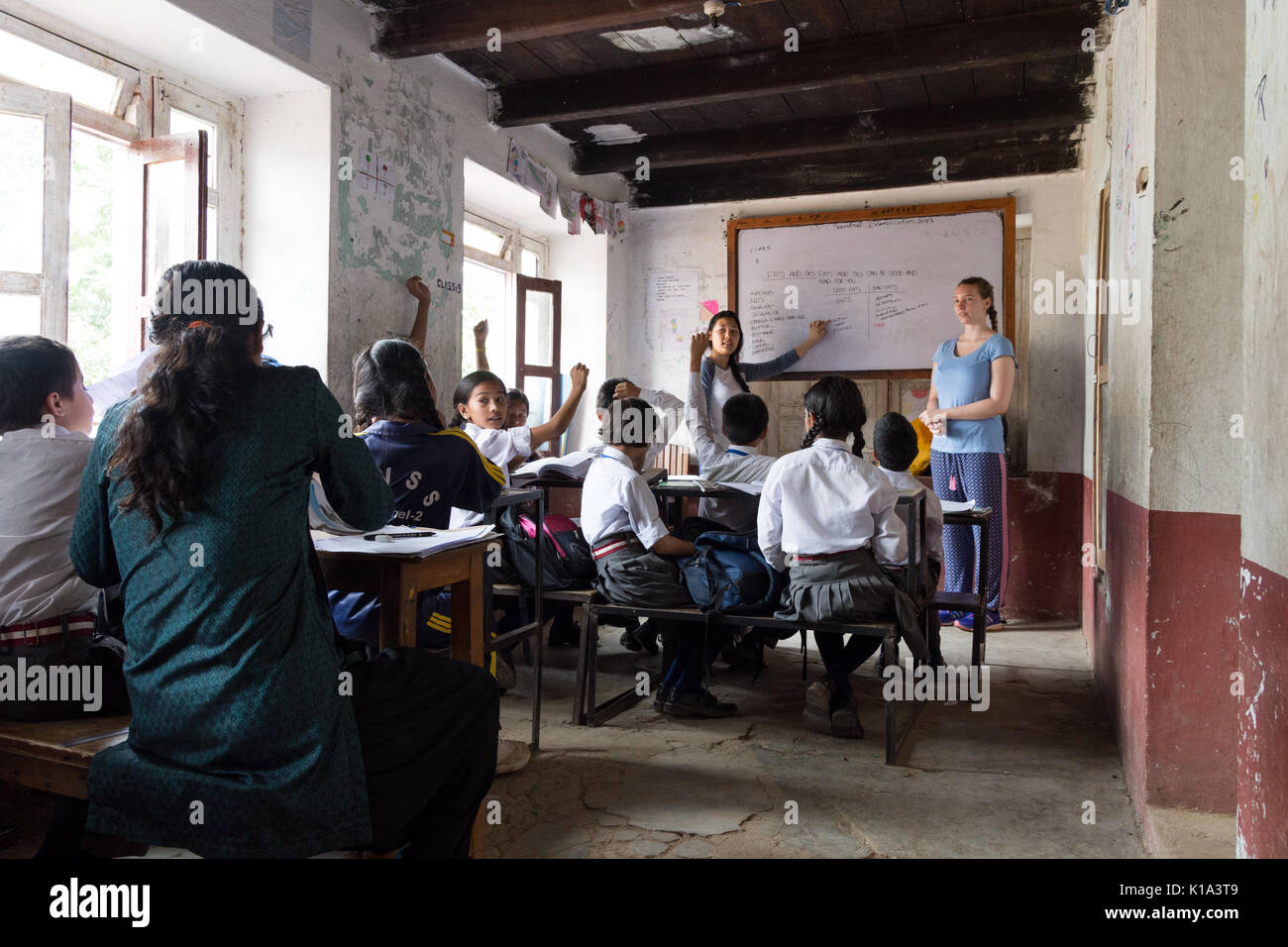 School children in the rural town of Dhulikhel enjoying a lesson from ...
