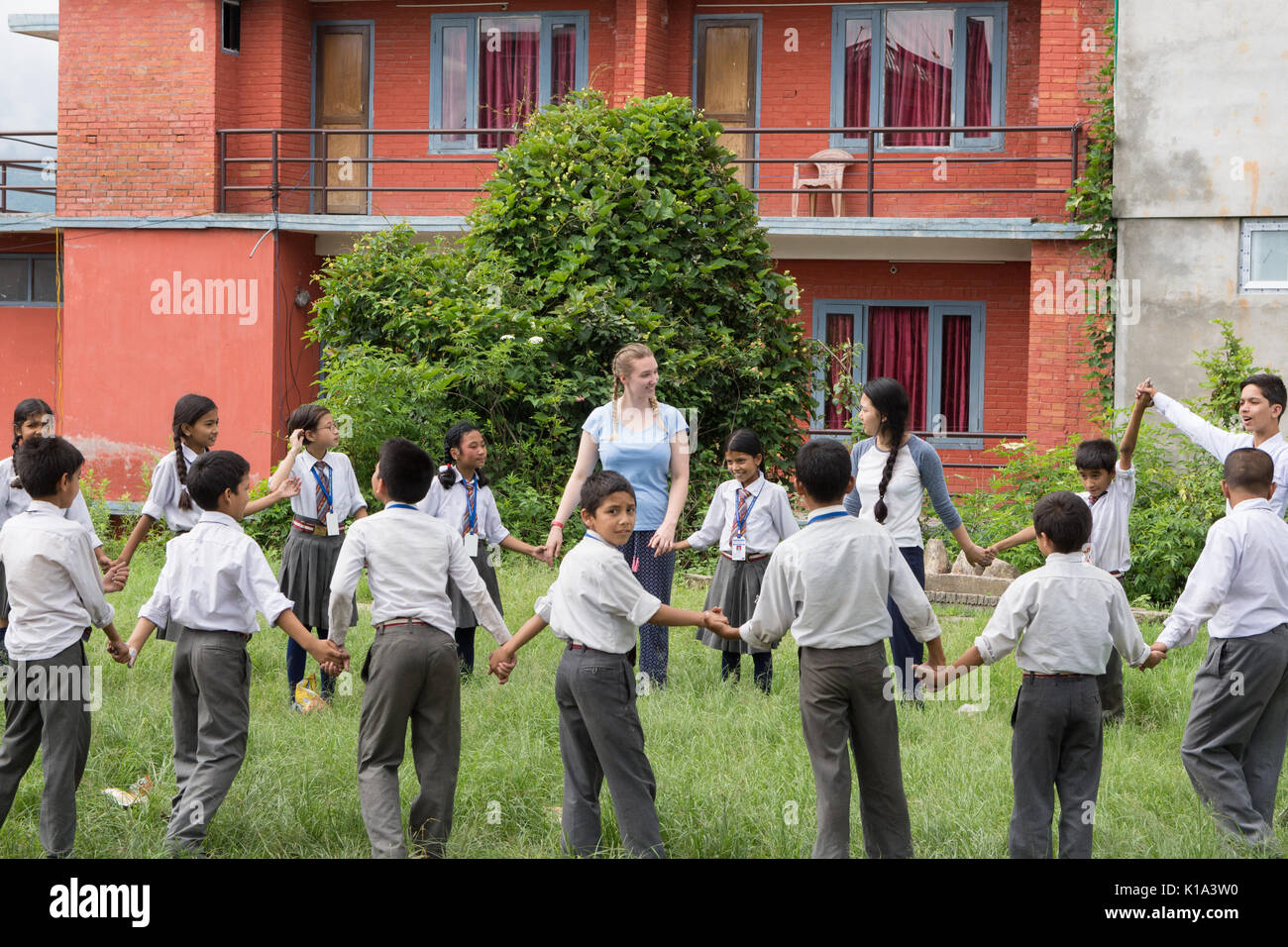 School children in the rural town of Dhulikhel enjoying a lesson from ...