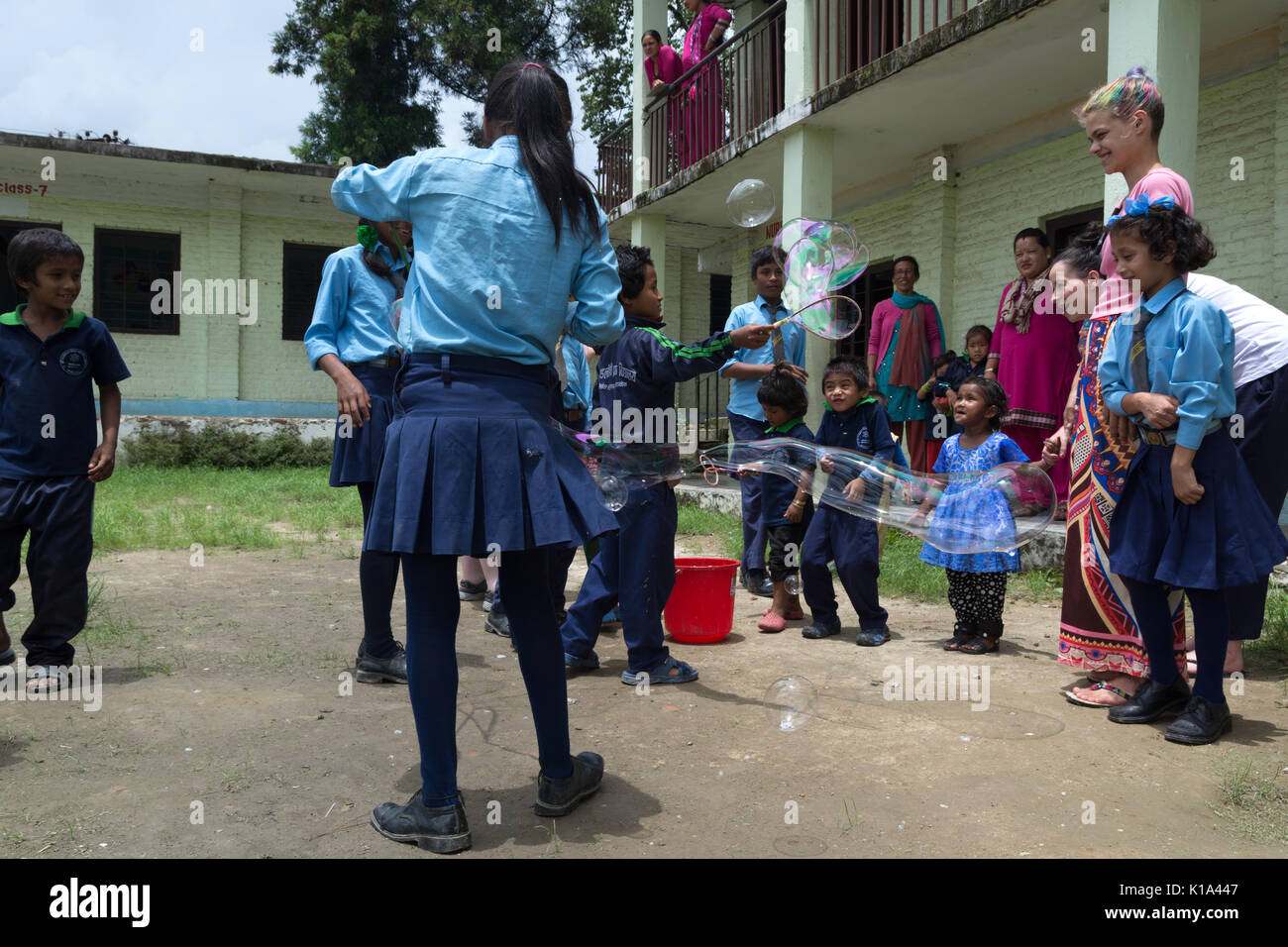 School children in the rural town of Dhulikhel enjoying a lesson from ...