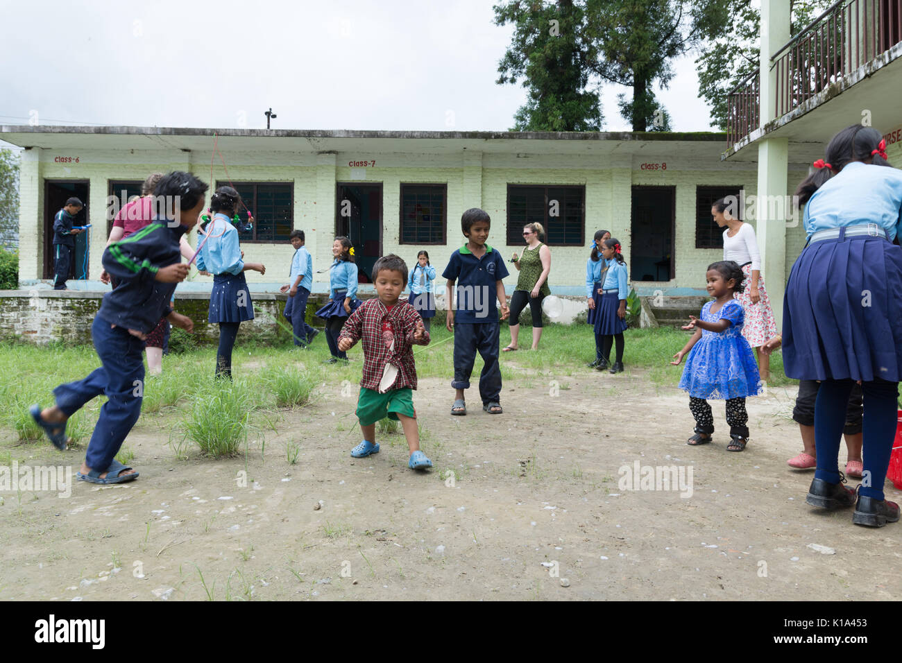 School children in the rural town of Dhulikhel enjoying a lesson from ...
