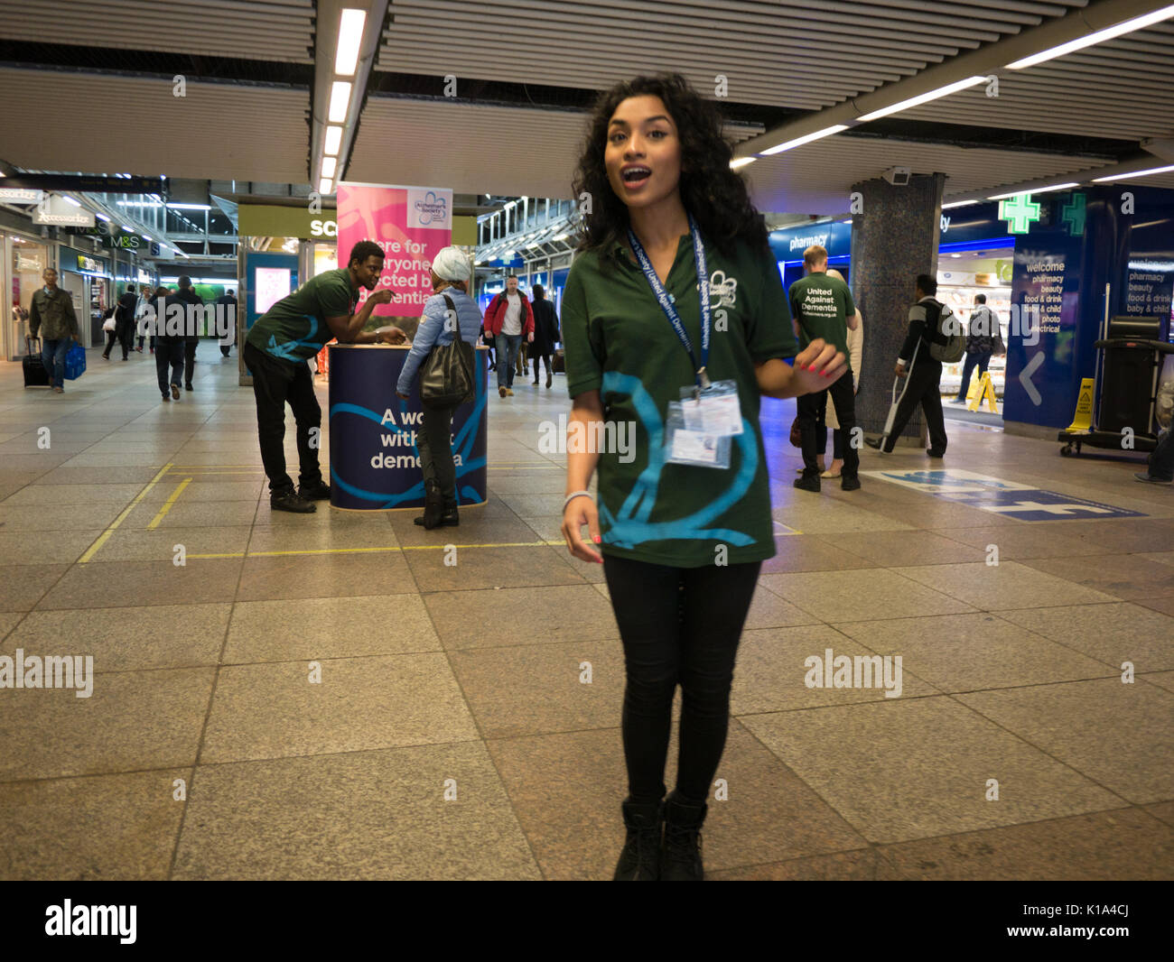 Dementia charity worker collector known as paid street fundraisers or ...
