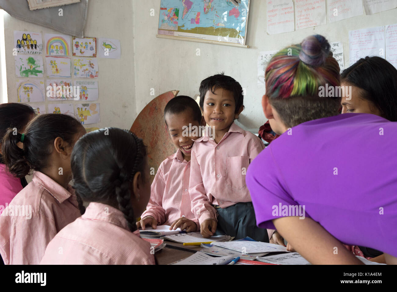 School children in the rural town of Dhulikhel enjoying a lesson from ...