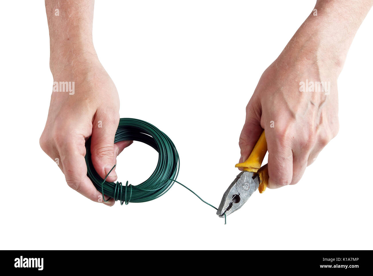 The elderly male master works with iron wire. Top view, isolated on ...