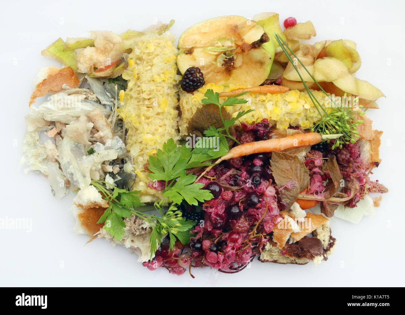 On the white kitchen table lie food waste, which remained when cooking ...