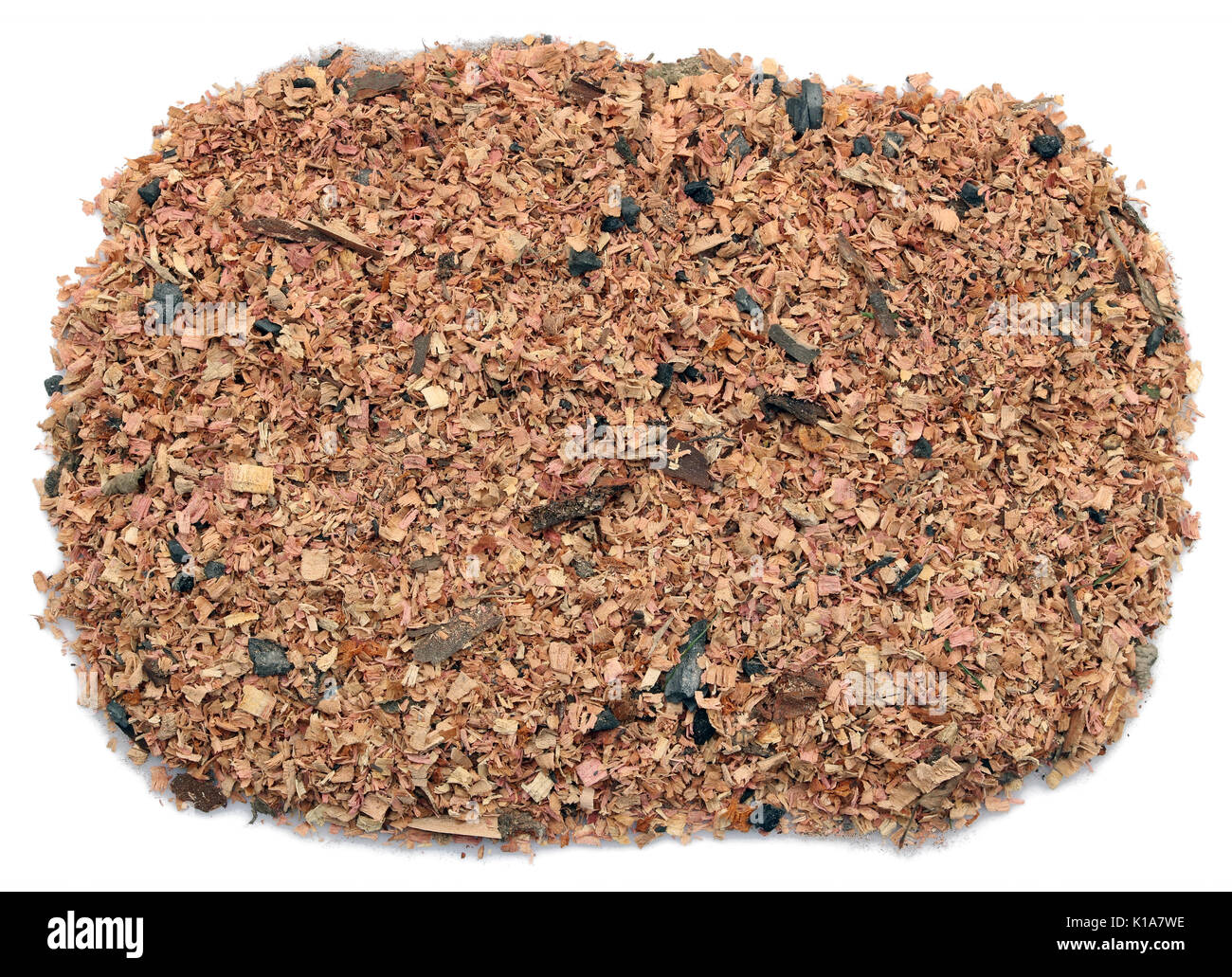 A large oval pile of dirty red sawdust cherry and plum trees. Isolated ...
