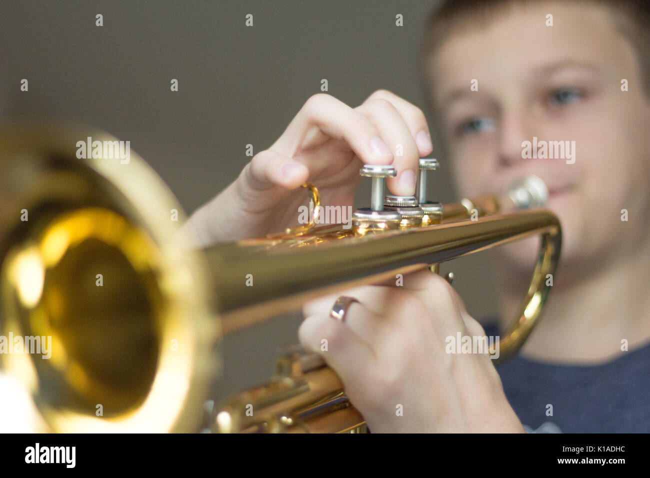 Boy practicing trumpet hi-res stock photography and images - Alamy