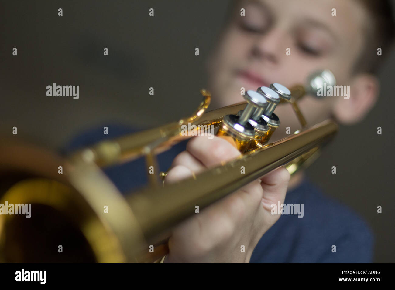 Young Boy Practicing his Trumpet Stock Photo - Alamy
