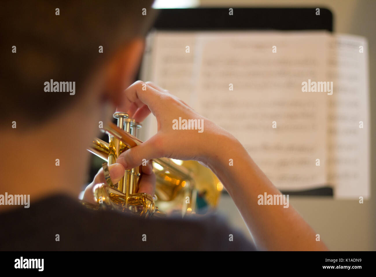 Young Boy Practicing his Trumpet Stock Photo - Alamy