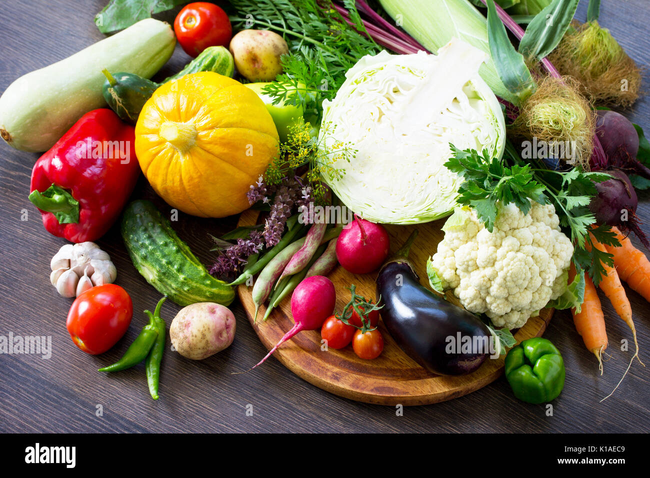 Fresh mixed different vegetables on a wooden oak background. Food ...