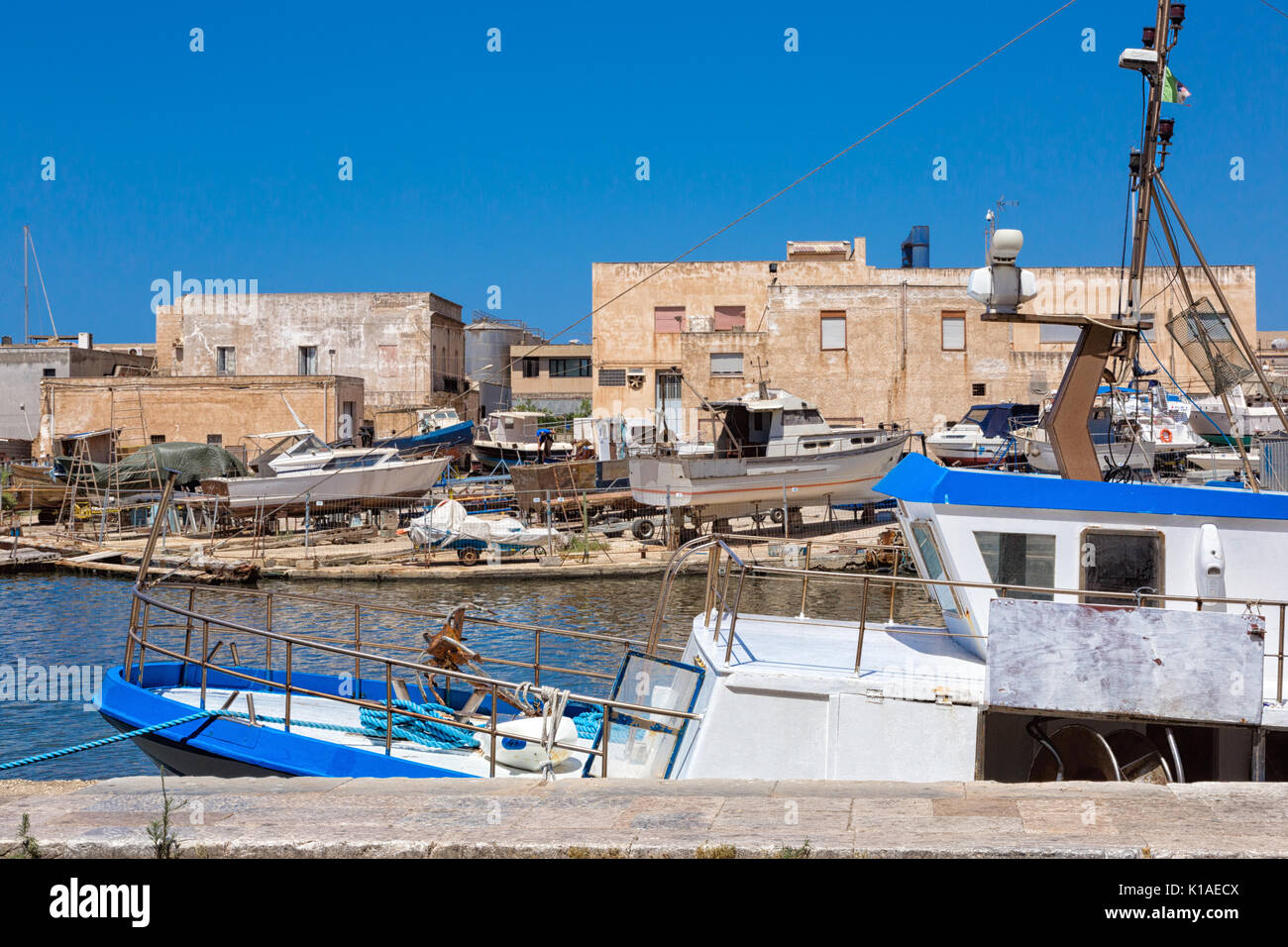 Mazara del Vallo (Italy) - Day view of canal, fishing boats and ...