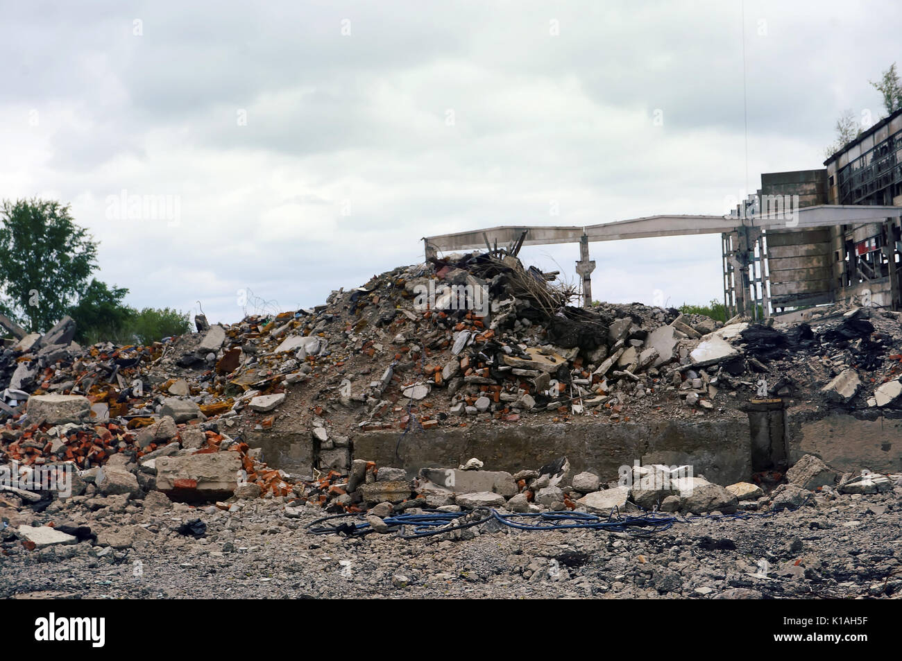 Destroyed the factory building and the road as after shelling. The ...
