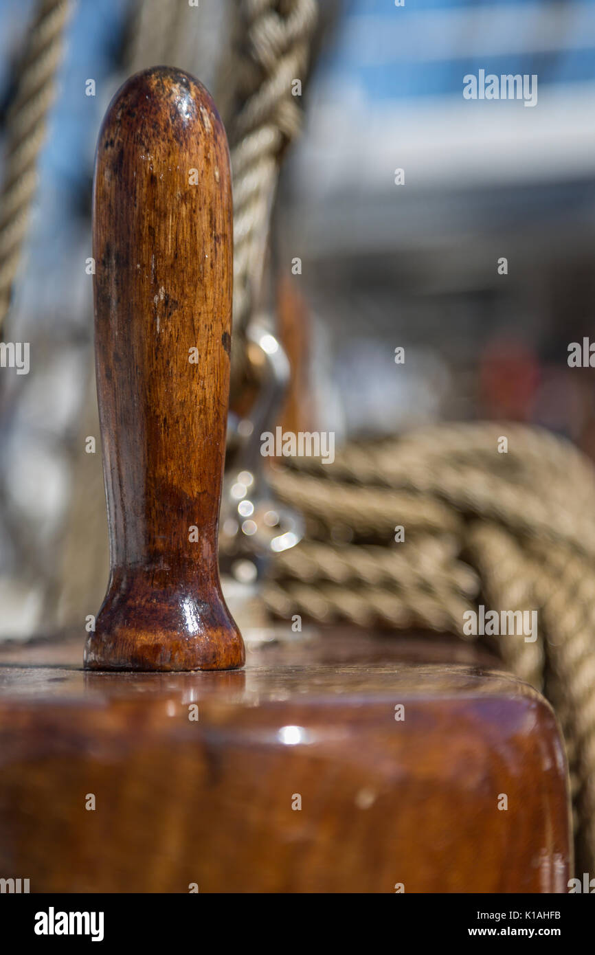 Ropes and wooden bollards on a sailing ship Stock Photo - Alamy