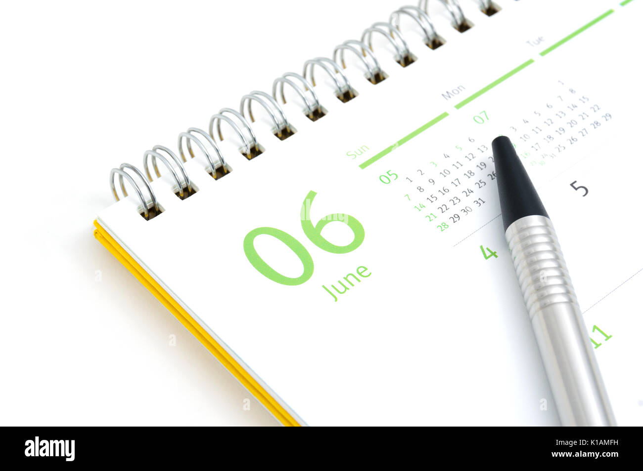 Desk calendar and pen on white background Stock Photo - Alamy
