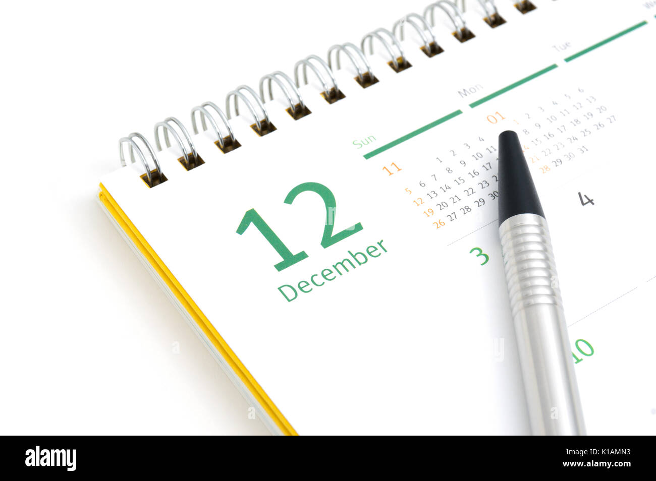Desk calendar and pen on white background Stock Photo - Alamy