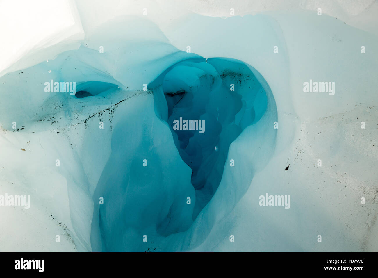 Inside a turqoise blue glacial ice formation, Fox Glacier, New Zealand ...
