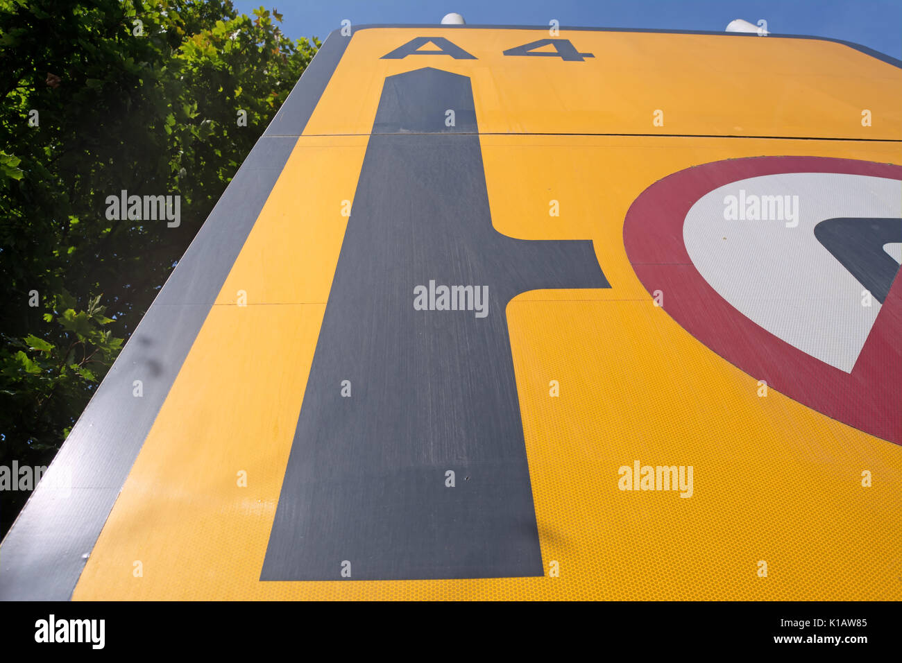 british yellow and black road sign showing A4 route Stock Photo - Alamy