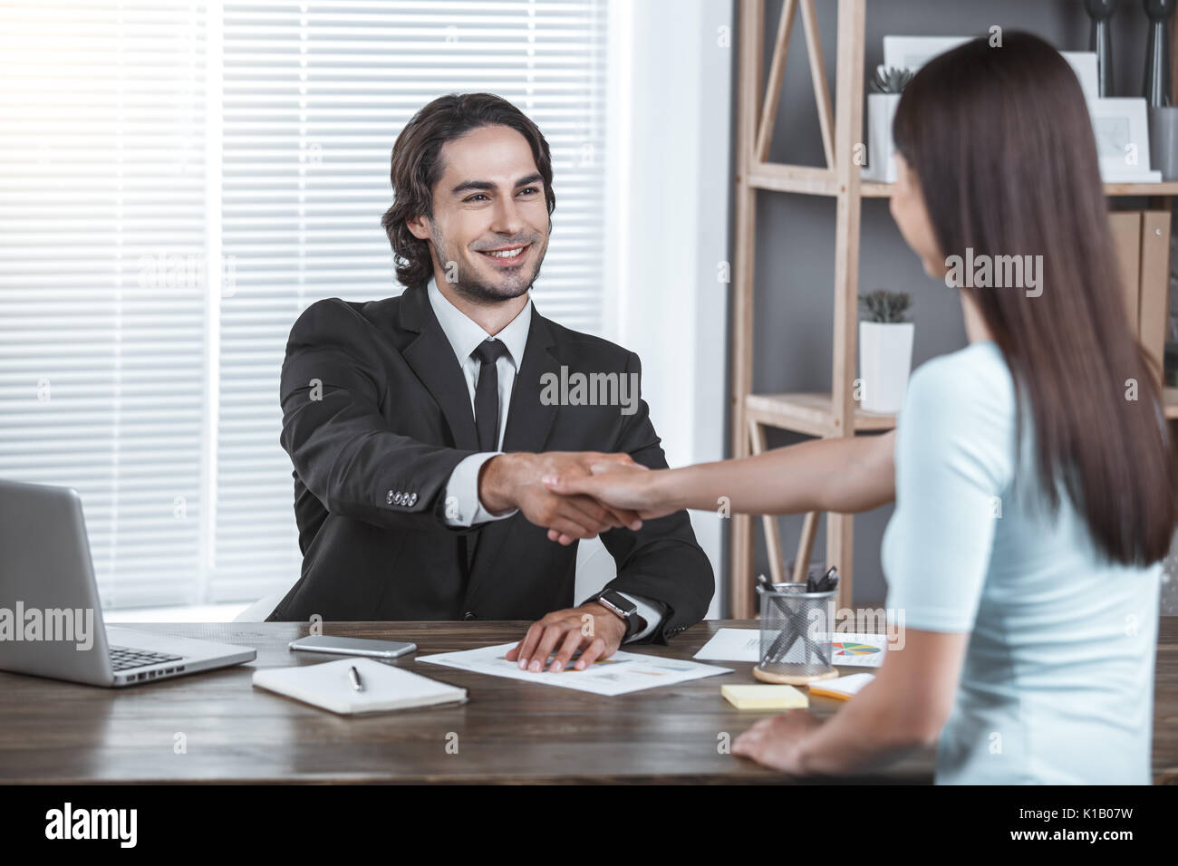 Business person working in the office service handshake Stock Photo - Alamy