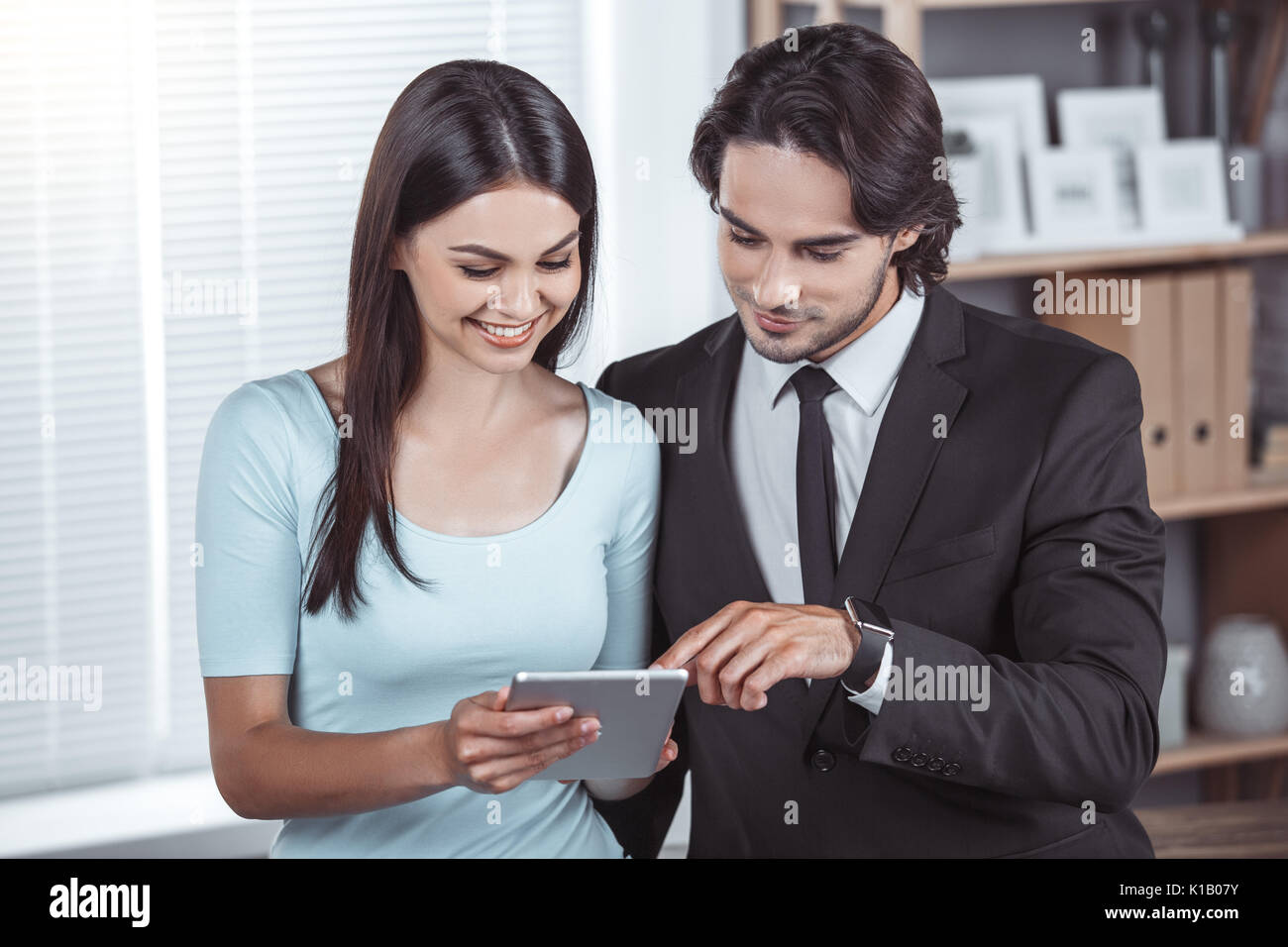 Business person working in the office service holding digital tablet ...