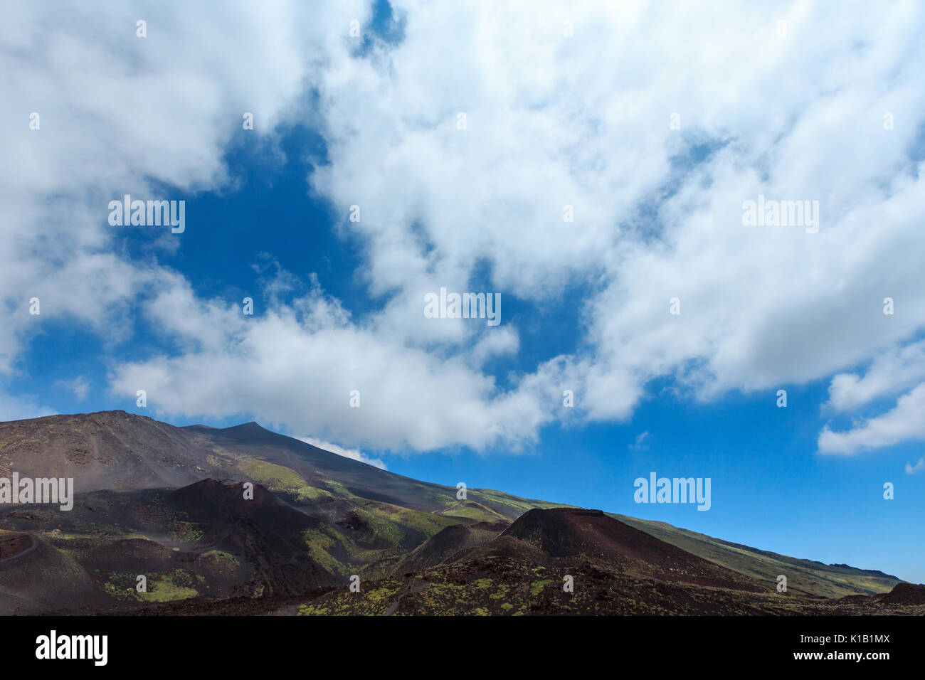 Summer Etna volcano mountain craters and blue cloudy sky, Sicily, Italy ...
