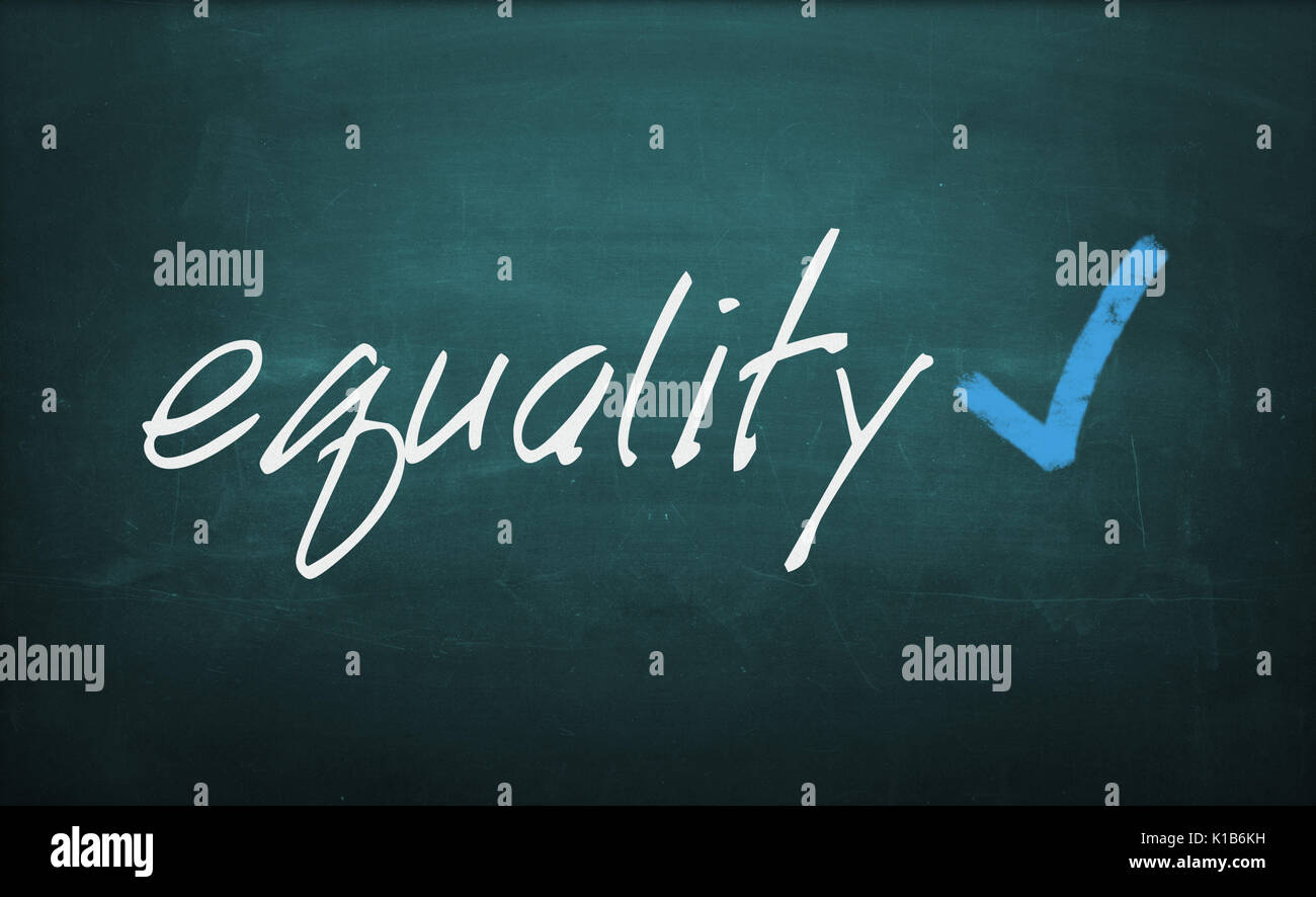 Conceptual text "Equality" written with chalk on a dirty blackboard and ...