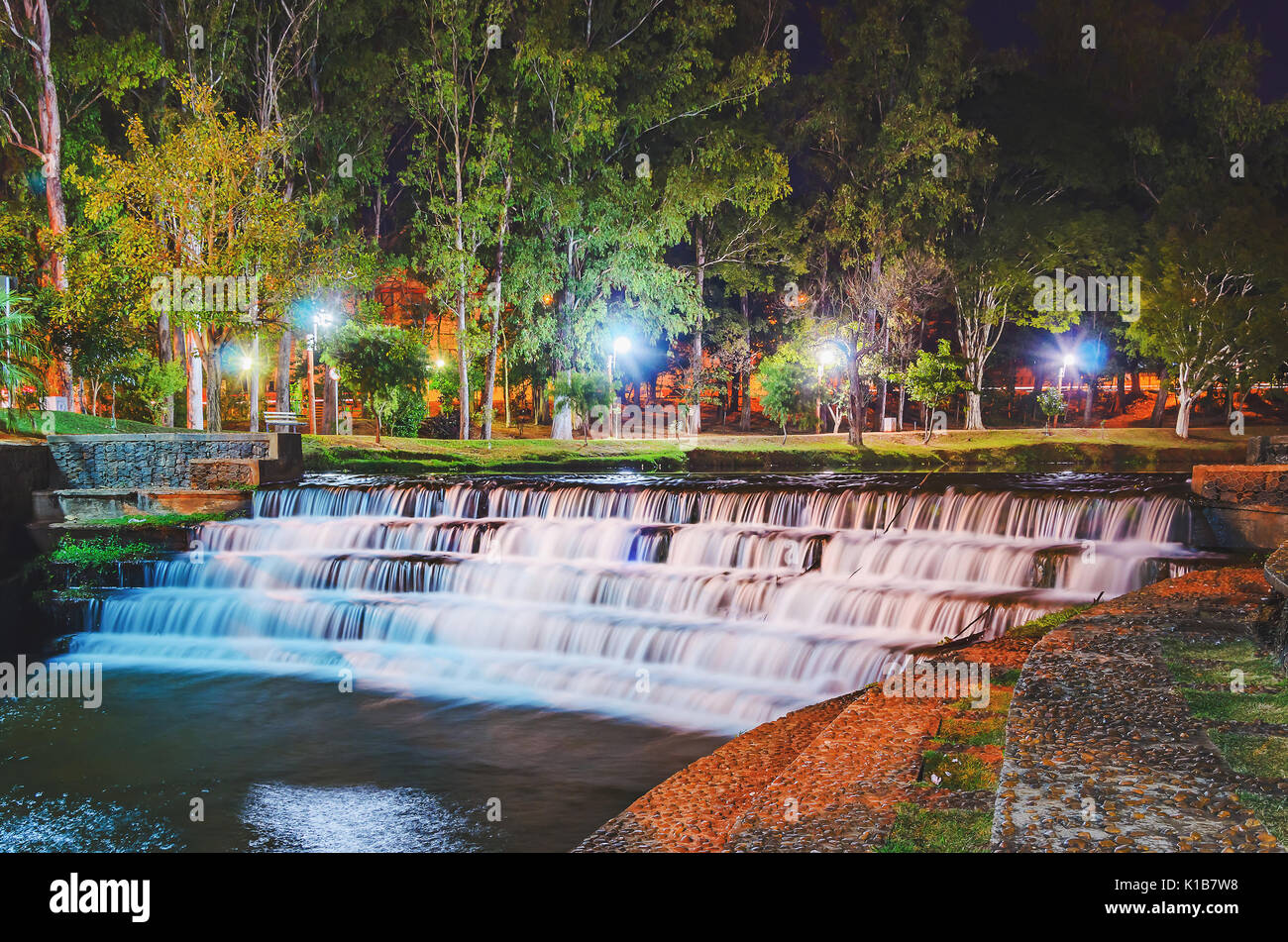Waterfall in sequence of steps made by man on a long exposure photo ...