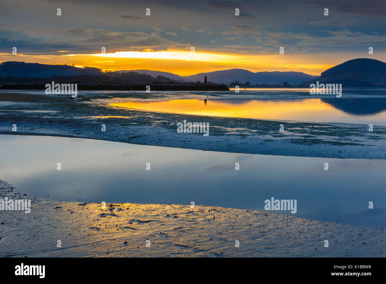 Tidal beach at sunset. Santoña, Victoria and Joyel Marshes Natural Park ...