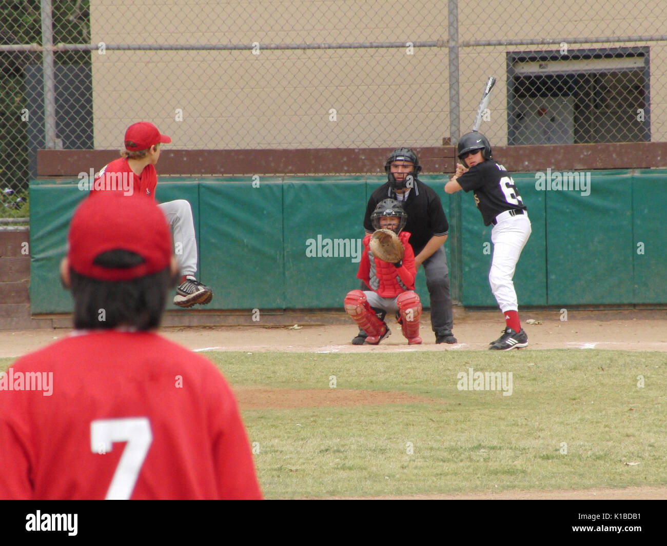Teamwork. Baseball team of youth in action. Pitcher's movement. Hitter ...