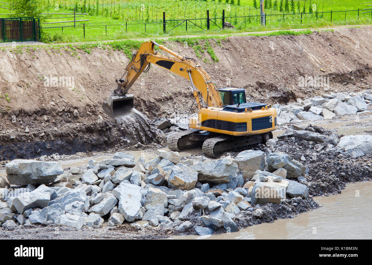 excavator machine at work on construction site Stock Photo - Alamy