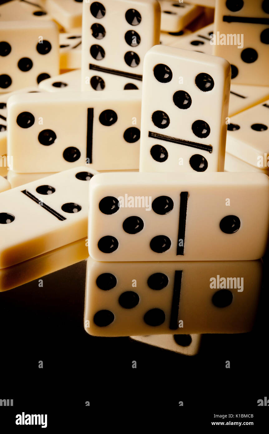 dominoes pieces scattered Stock Photo - Alamy
