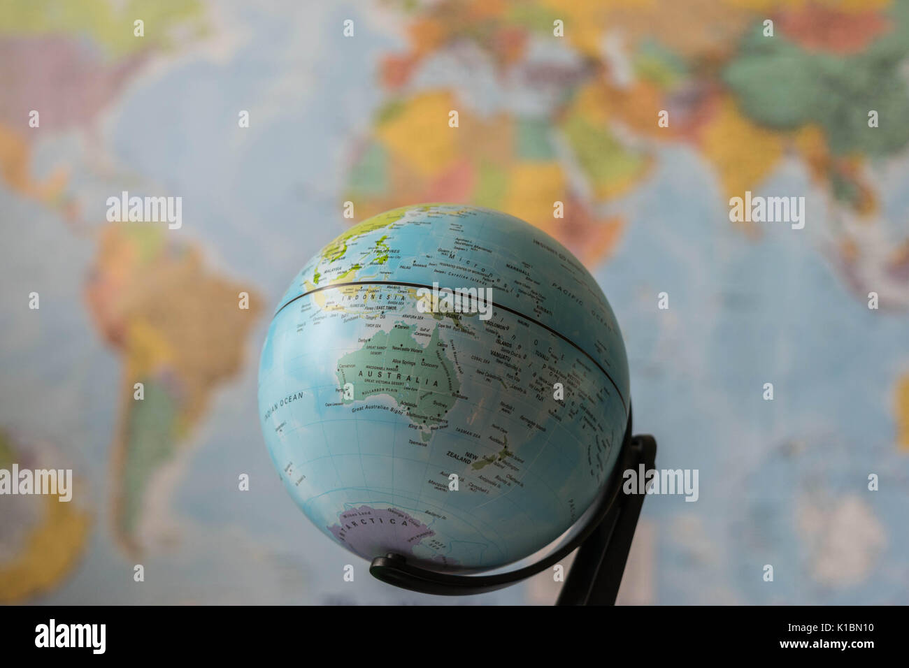 Australia map on a globe with the whole world as background Stock Photo ...