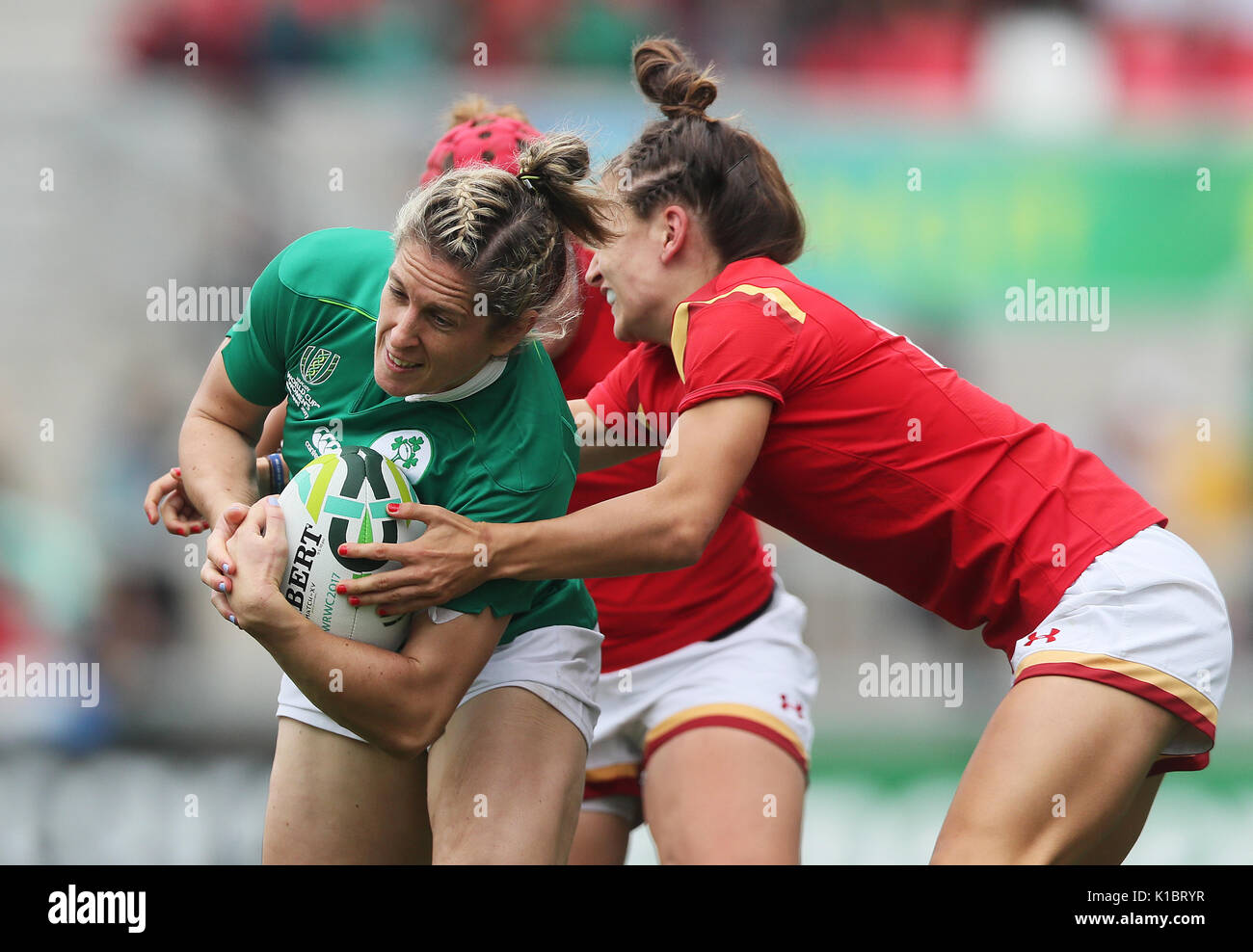 Ireland's Alison Miller is tackled by Wales' Jasmine Joyce during the ...