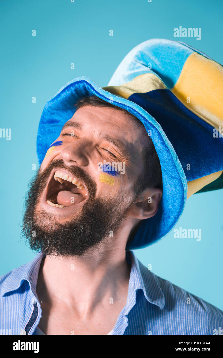 The football fan over blue Stock Photo - Alamy