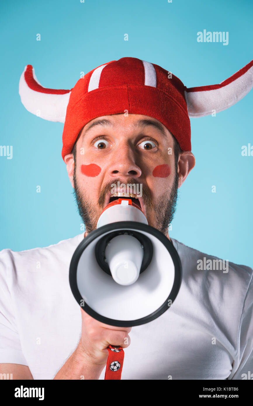 The football fan over blue Stock Photo - Alamy
