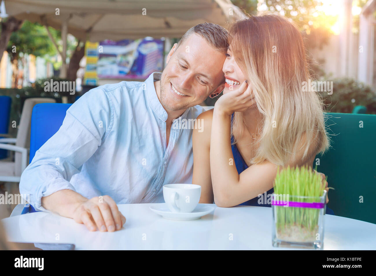 Couple dating drinking coffee Stock Photo - Alamy