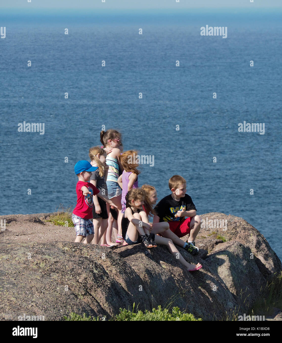 Children on the rock hi-res stock photography and images - Alamy