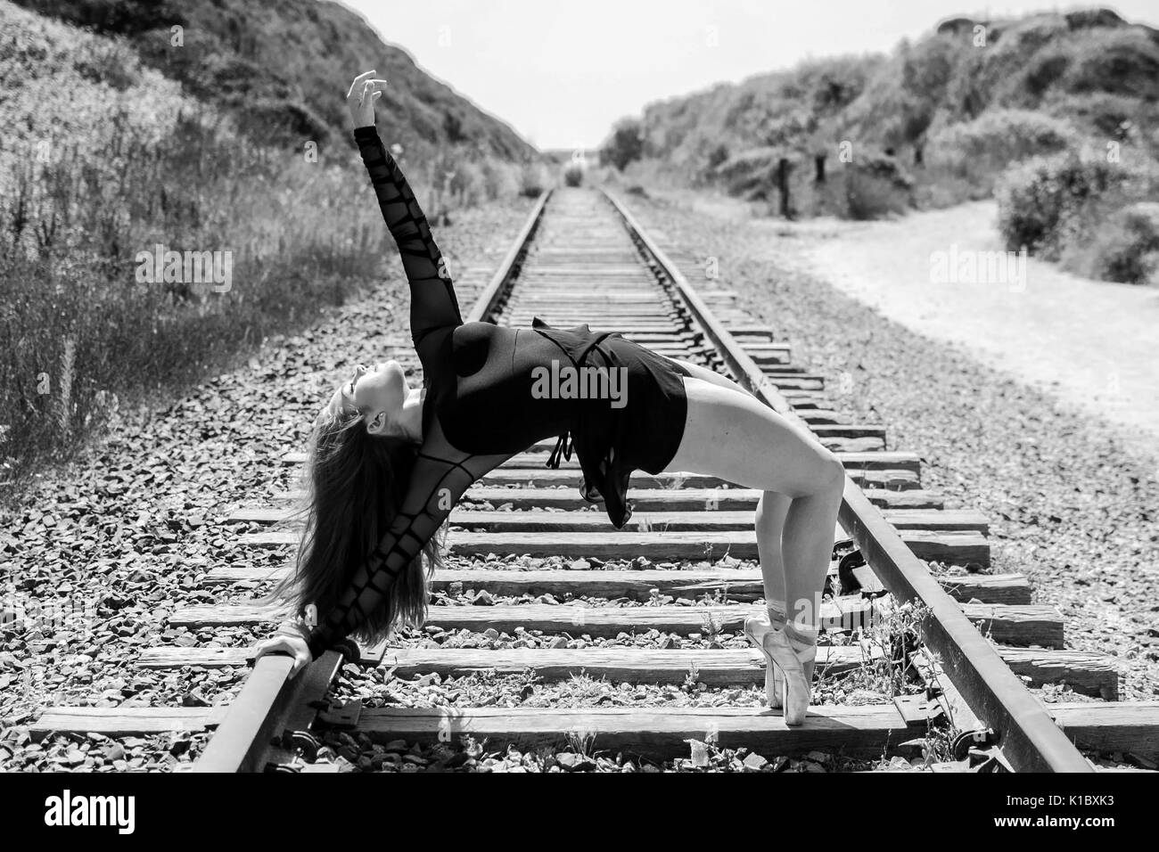 Dancer Reaching on the Tracks Stock Photo - Alamy