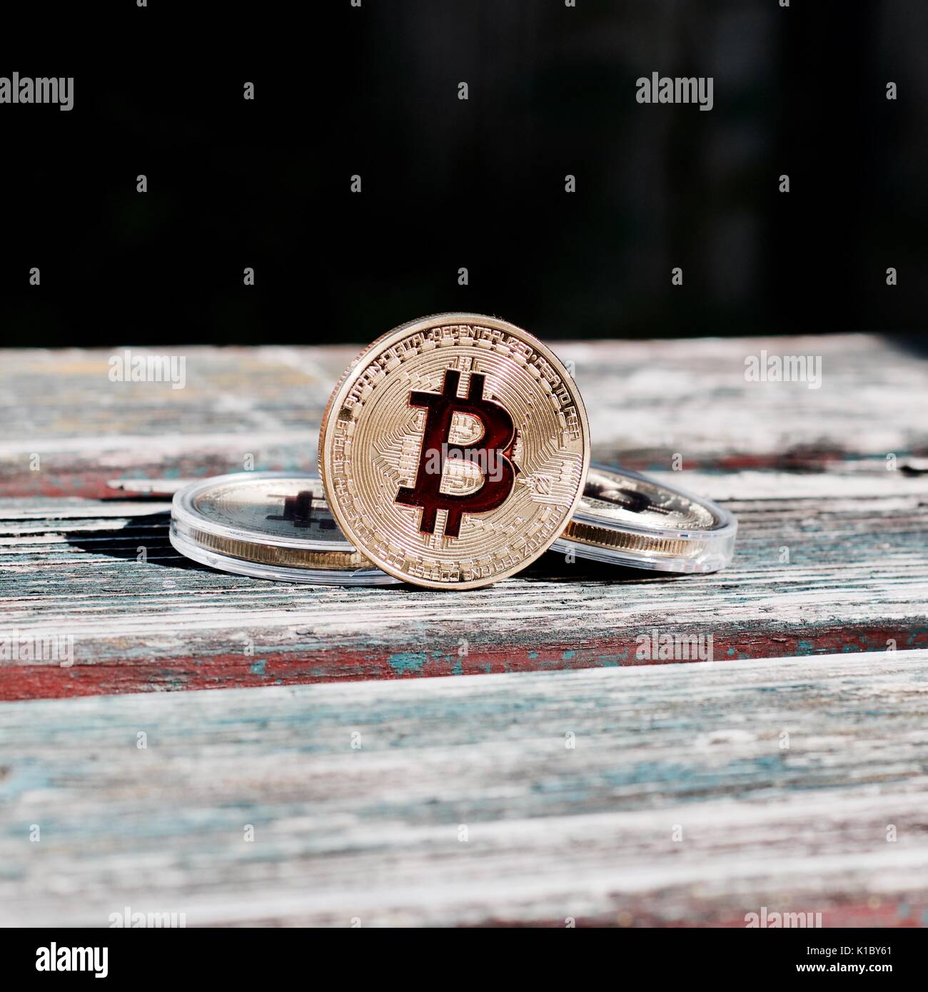 Digital currency physical gold red bitcoin coin. Outdoor money concept ...