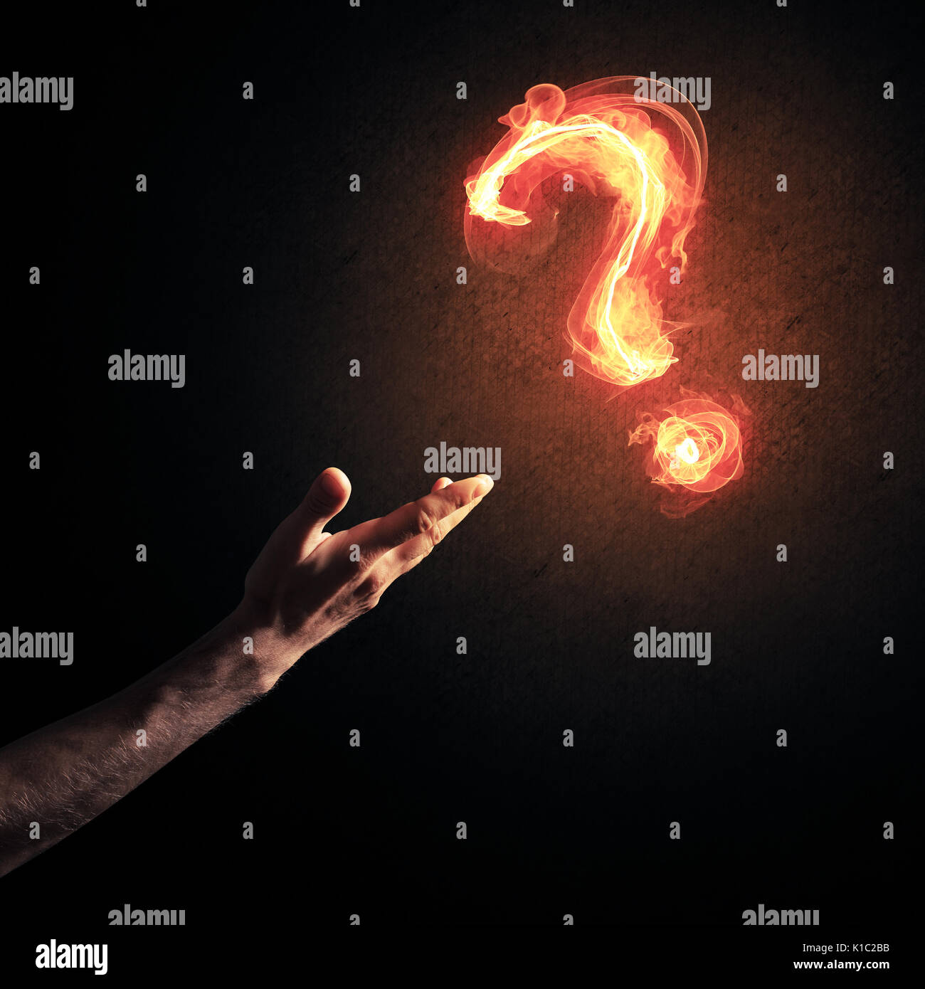 Close of man hand showing burning fire sign on dark background Stock ...