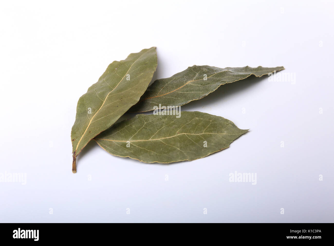Aromatic dried bay leaves on white background Stock Photo - Alamy