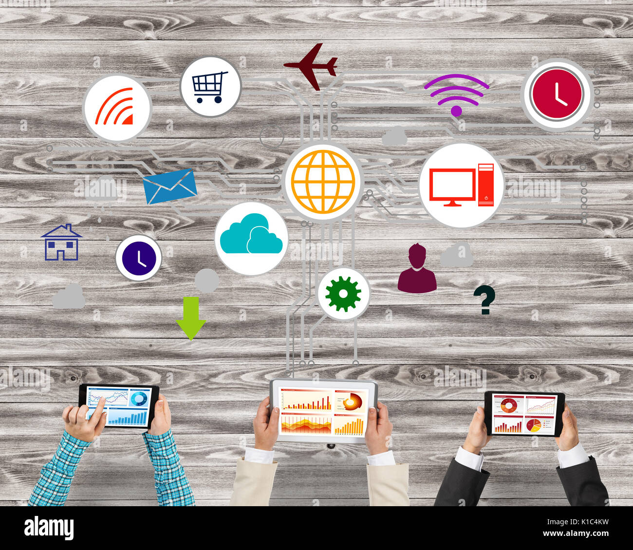 Group of three people with devices in hands working together as symbol ...