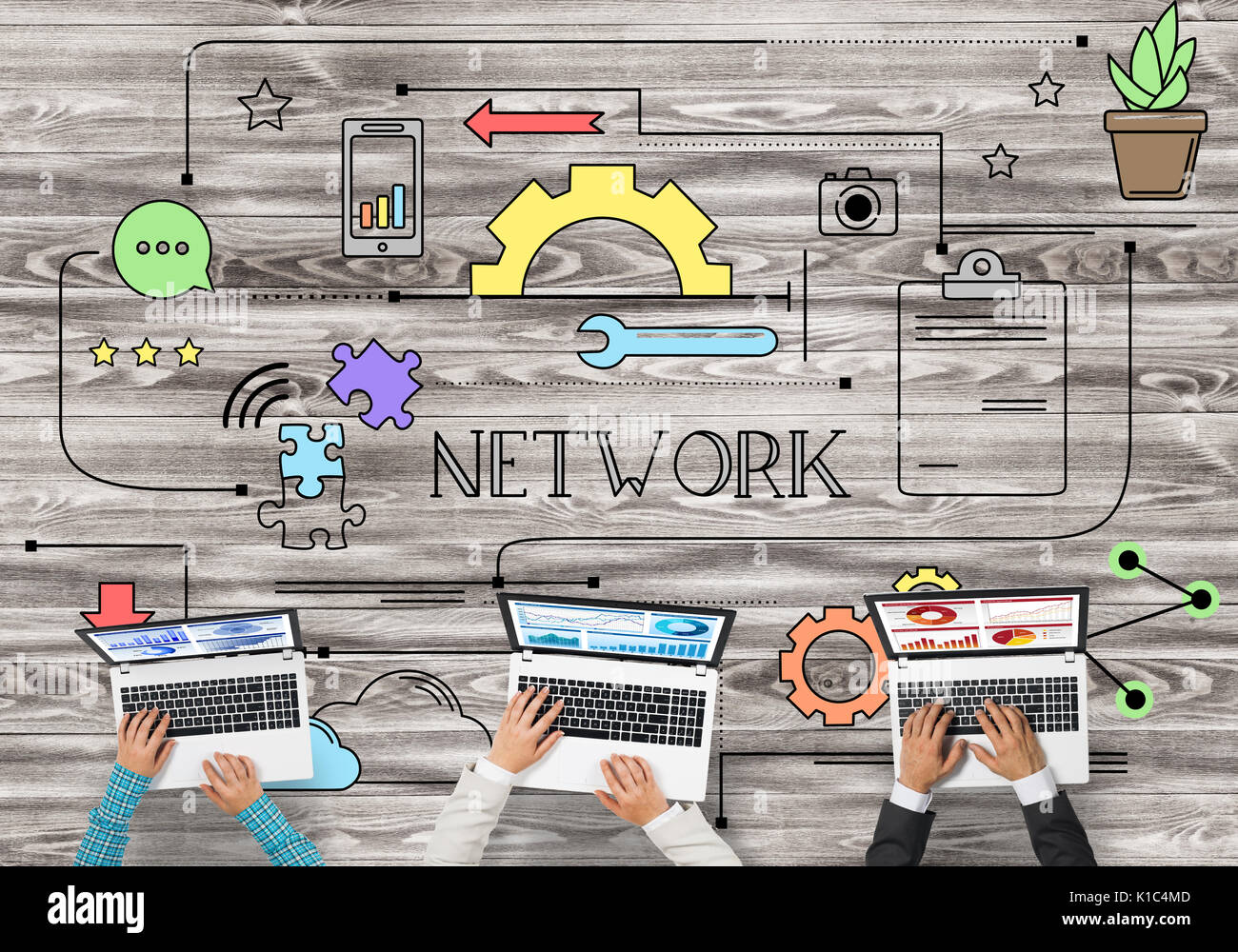 Group of three people with devices in hands working together as symbol ...