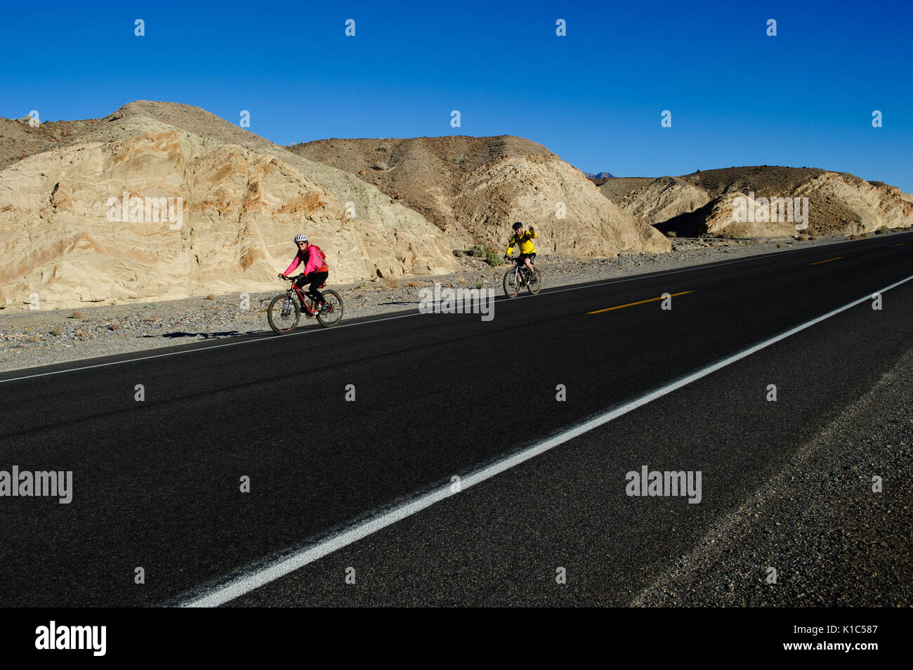 Cyclists at road 190, Death Valley NP Stock Photo - Alamy