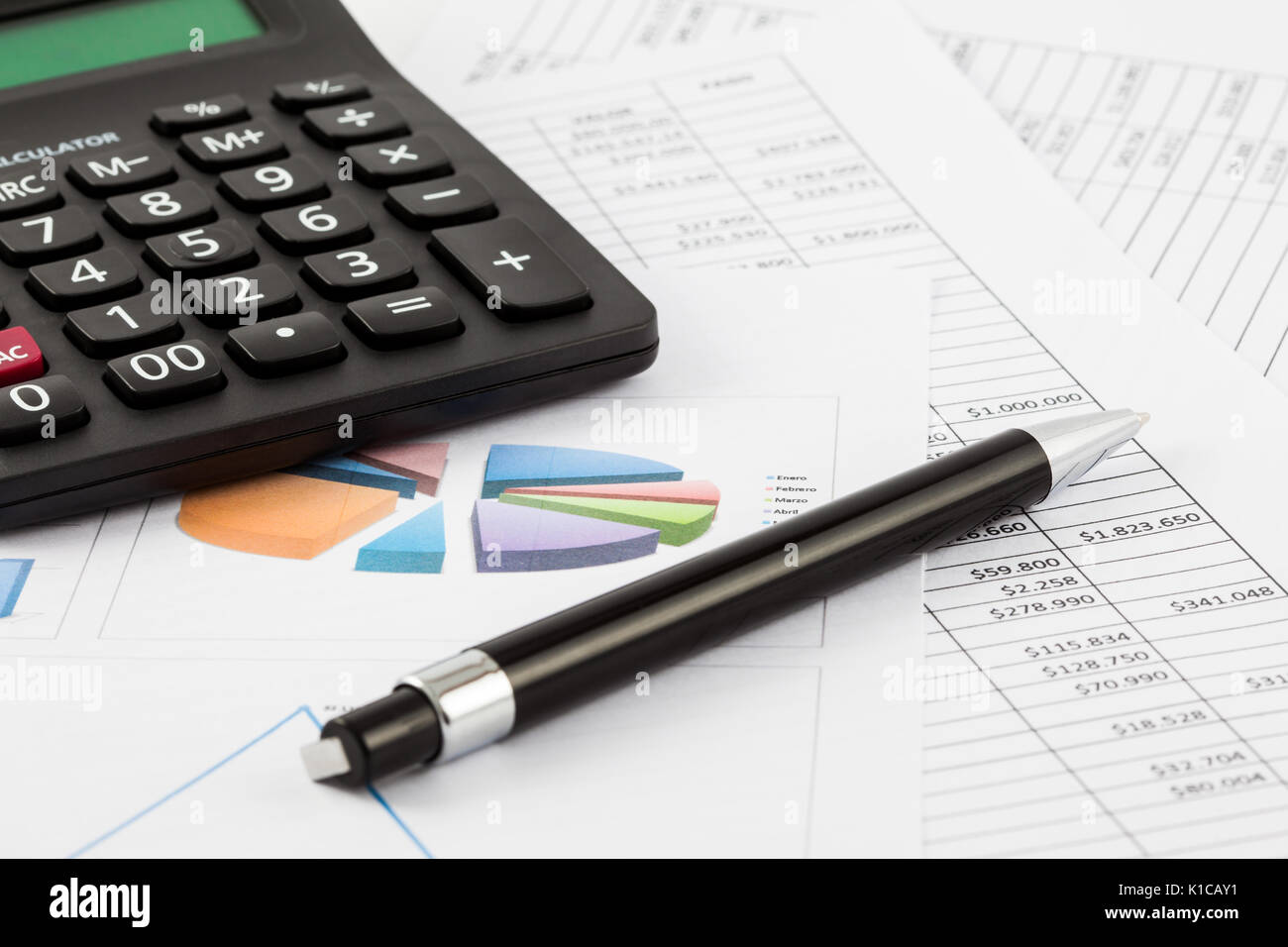 Monthly budget spreadsheet, pen and calculator Stock Photo - Alamy