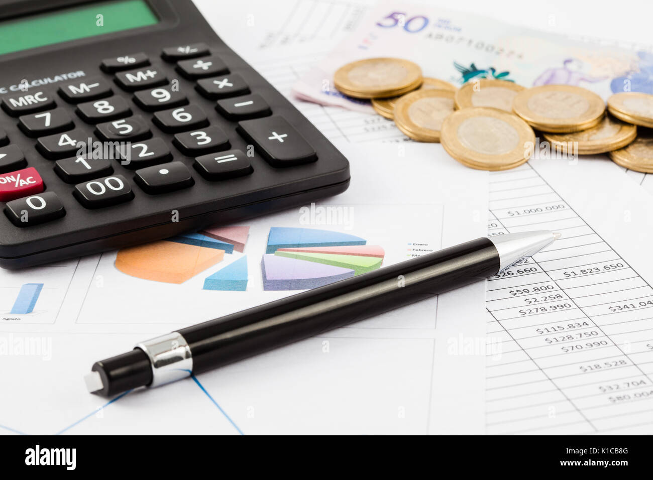 Monthly budget spreadsheet, money, pen and calculator Stock Photo - Alamy