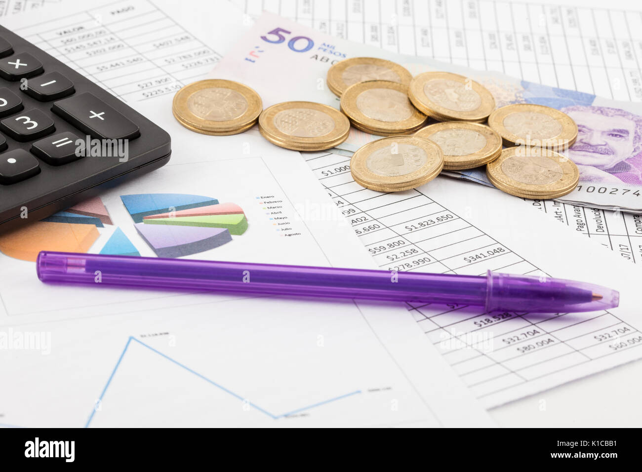Monthly budget spreadsheet, money, pen and calculator Stock Photo - Alamy