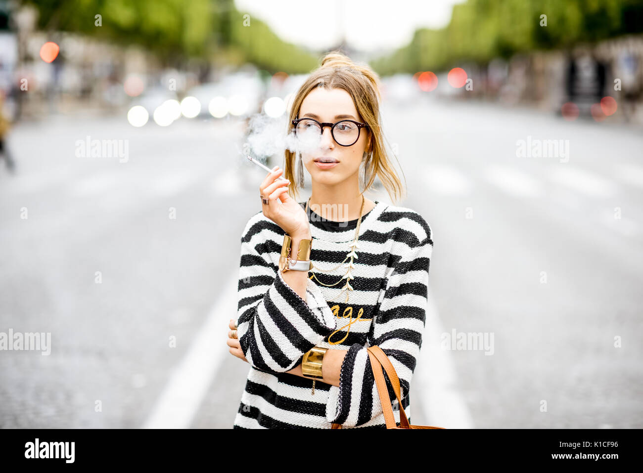 French woman smoking cigarette hi-res stock photography and images - Alamy