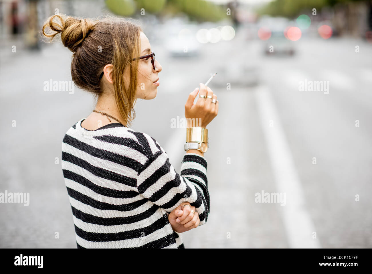 French woman smoking cigarette hi-res stock photography and images - Alamy